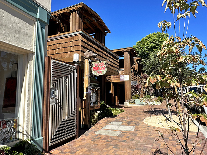 The rustic wooden exterior of Hog's Breath Inn welcomes you like an old friend, its iconic sign promising culinary adventures in the heart of charming Carmel-By-The-Sea.