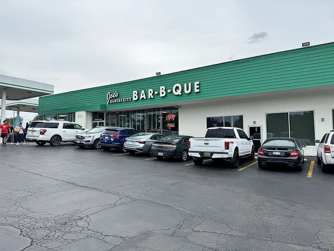 The iconic green exterior of Joe's KC BBQ beckons like a barbecue lighthouse, promising smoky treasures within this former gas station turned culinary landmark.