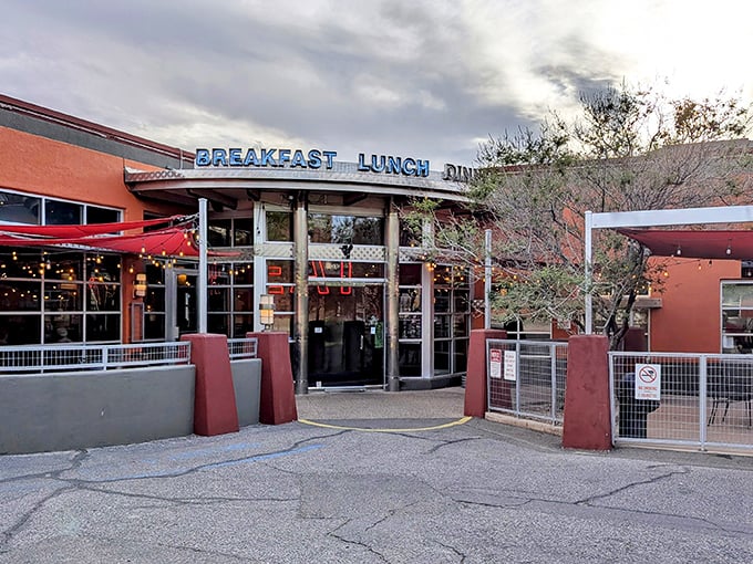 The iconic red exterior of Range Cafe beckons hungry travelers with its bold "BREAKFAST LUNCH DINNER" promise—a siren song for comfort food enthusiasts.
