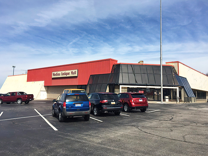 The unassuming red-trimmed exterior of Medina Antique Mall&mdash;like finding a treasure chest disguised as a regular building.