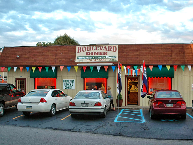 The Boulevard Diner's cheerful exterior, with its colorful pennant flags, stands as a beacon of breakfast hope on Wilkes-Barre's busy thoroughfare.