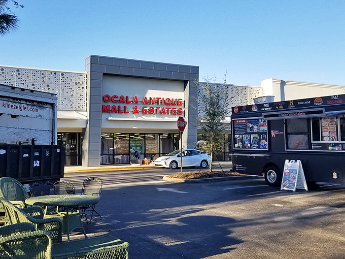 The modern facade of Ocala Antique Mall belies the time-traveling adventure waiting inside. Red signage beckons treasure hunters from across Florida.