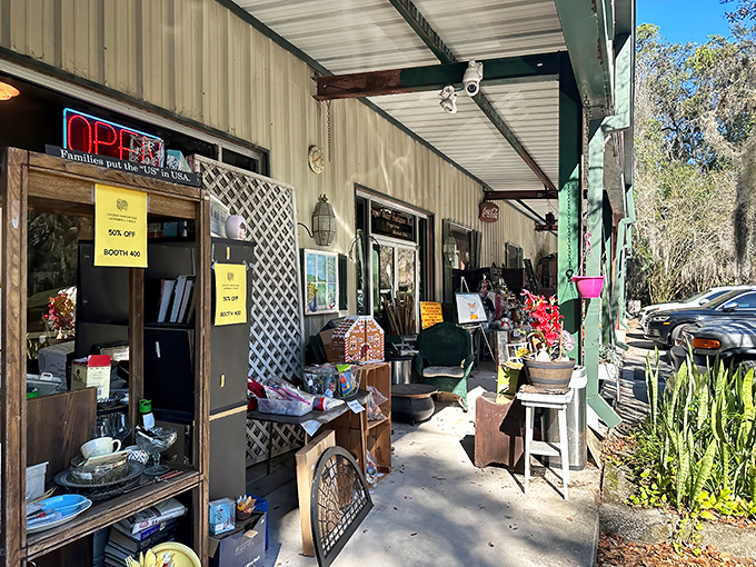 Spanish moss drapes over Sugar Bear Antiques like nature's welcome sign. This unassuming exterior holds treasures that would make Indiana Jones rethink his career path.