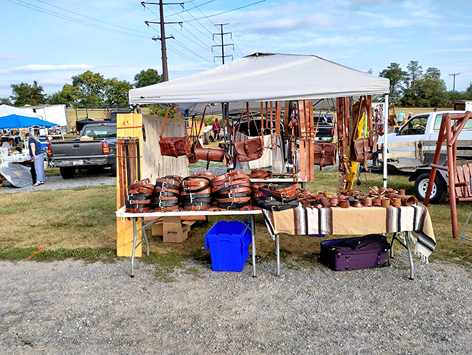 Outdoor vendors display handcrafted leather goods under pop-up tents. The treasure hunt begins before you even step inside!