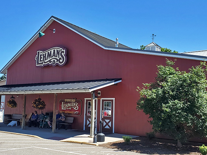 The iconic red barn exterior of Lehman's stands like a beacon of nostalgia against the Ohio sky, promising treasures that time hasn't forgotten.