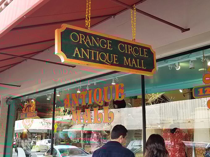 The unassuming storefront of Orange Circle Antique Mall beckons with promises of treasures within. Like a time portal disguised as a retail space.