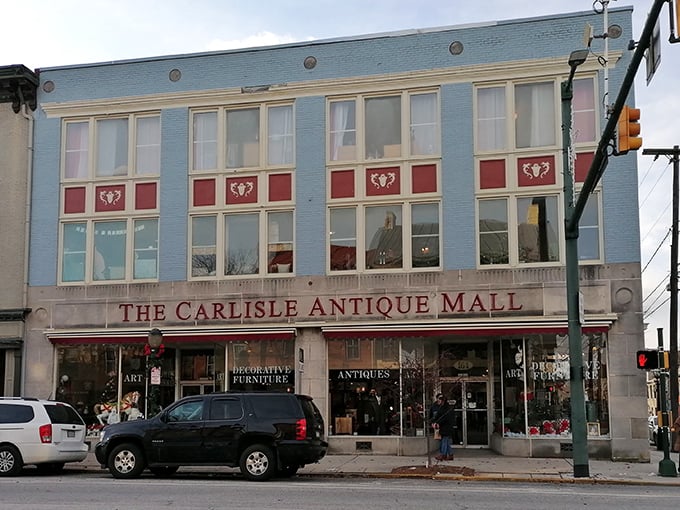 The iconic blue and red fa&ccedil;ade of The Carlisle Antique Mall beckons like a siren song for vintage enthusiasts on Carlisle's historic main street.