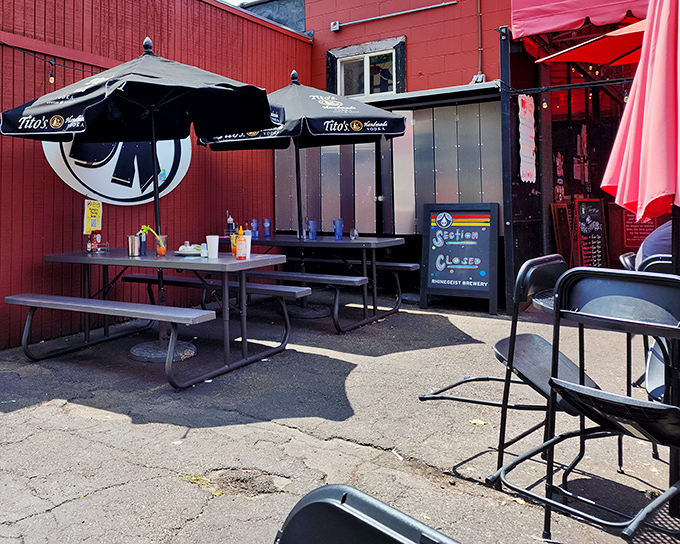 The unassuming red brick exterior of DK Diner hides culinary treasures within. Those picnic tables have witnessed countless breakfast epiphanies.