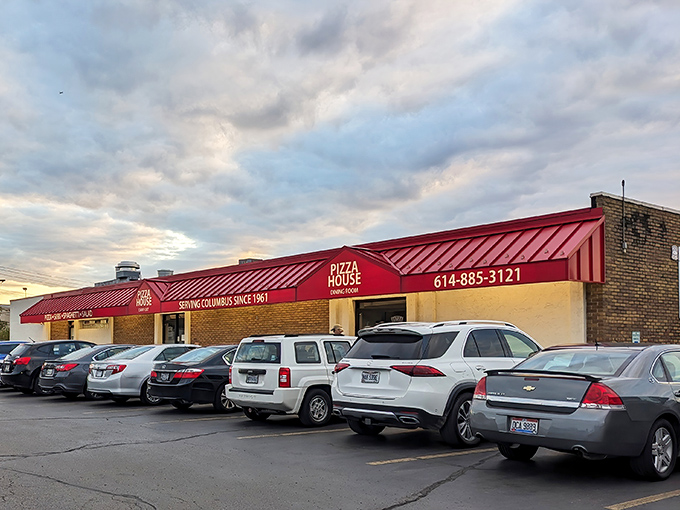 The iconic red roof of The Pizza House stands as Columbus's culinary lighthouse, beckoning hungry patrons for generations with its no-nonsense charm.