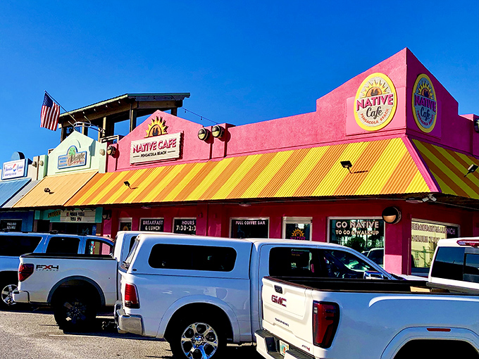 The hot pink facade of Native Cafe isn't just a building—it's a mood statement that screams "vacation calories don't count!"