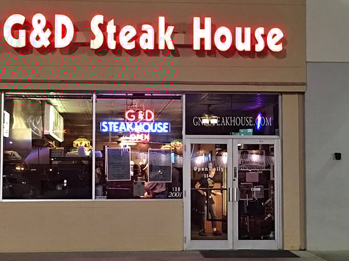 The iconic neon sign of G & D Steakhouse glows like a beacon for hungry travelers, promising unpretentious comfort and satisfying meals in Columbia.