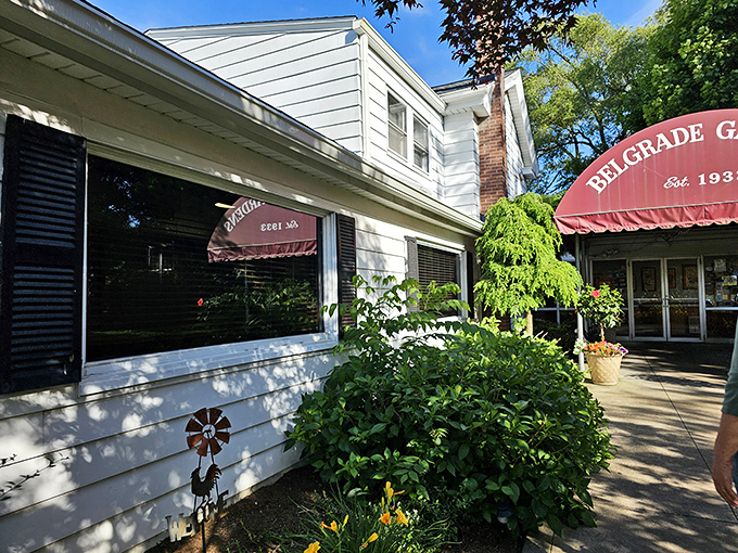 The iconic burgundy awning of Belgrade Gardens welcomes hungry pilgrims like a culinary lighthouse that's been guiding fried chicken enthusiasts since 1933.