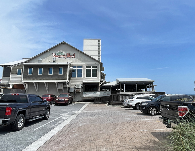Coastal charm meets beachfront dining at Runaway Island, where the weathered wood exterior promises authentic Florida flavors with unbeatable Gulf views.