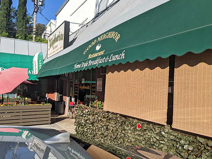 The unassuming green awning of Good Neighbor Restaurant beckons like an old friend, promising home-style comfort without the fanfare.