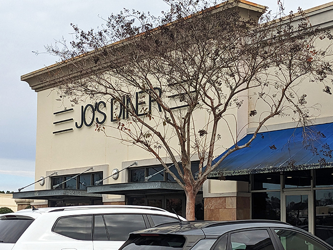 The unassuming exterior of Jo's Diner in Flowood hides a breakfast paradise within. That blue and white sign promises comfort food glory that delivers every time.