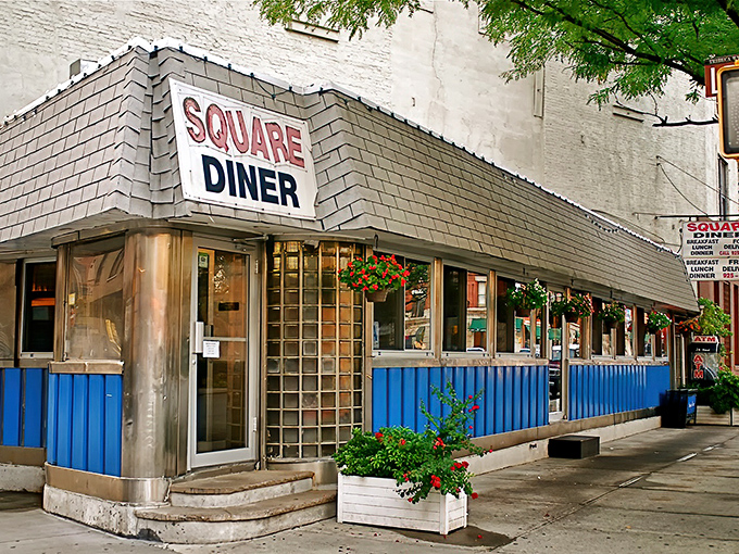 The iconic blue panels and stainless steel trim of Square Diner stand defiant against Tribeca's modernization, like your favorite uncle who refuses to upgrade his flip phone.