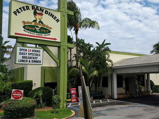 The iconic green and white sign welcomes hungry travelers like a beacon of breakfast hope. Palm trees and promise await.