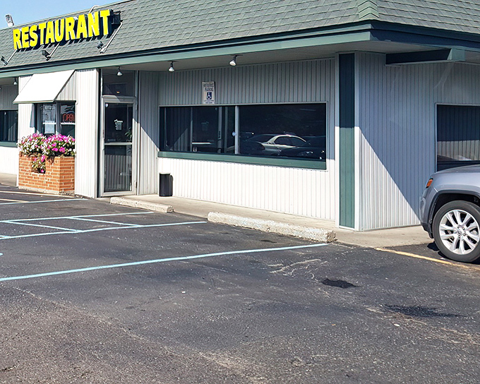 The humble green-roofed exterior of Four Korners Restaurant doesn't scream for attention, but locals know this unassuming spot hides culinary treasures worth discovering.