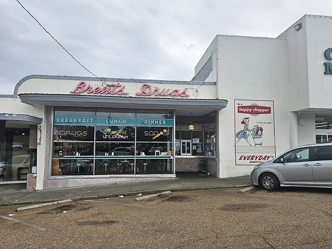 The neon promise of "Breakfast, Lunch, Dinner" glows beneath that iconic retro signage, like a time machine disguised as a storefront in Jackson's Fondren neighborhood.