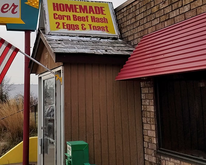 A humble brick fortress with an American flag standing guard, protecting the culinary treasures that await inside.