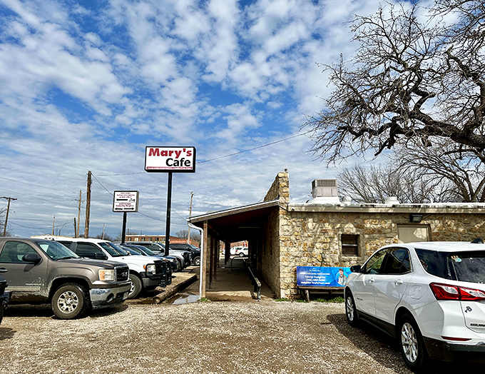 The unassuming exterior of Mary's Cafe stands proudly against the Texas sky &ndash; proof that culinary greatness often comes in humble packages.