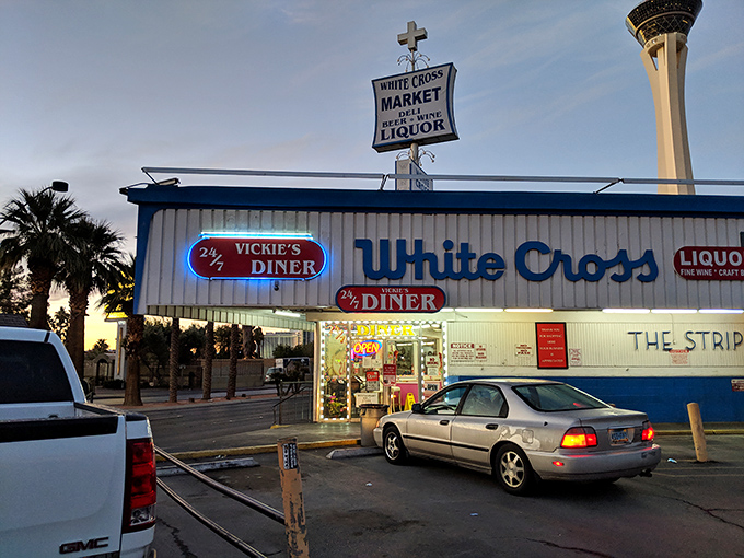 Vickie's Diner stands proudly alongside White Cross Market, a blast from Vegas past where neon promises and comfort food dreams come true 24 hours a day.
