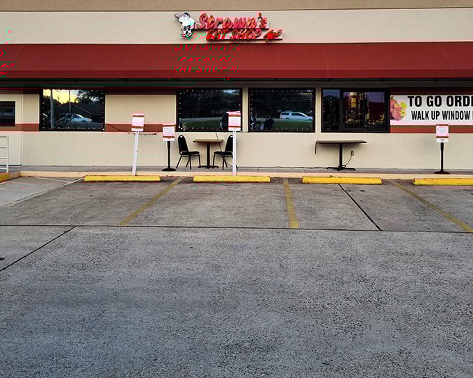 The unassuming red awning of Strawn's Eat Shop Too stands like a beacon to hungry travelers. No fancy frills needed when the food inside speaks volumes.