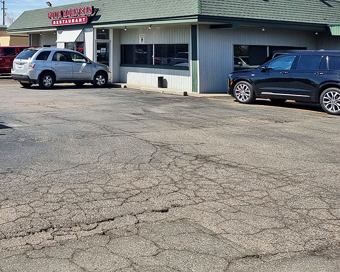 The humble green-roofed exterior of Four Korners Restaurant doesn't scream for attention, but locals know this unassuming spot hides culinary treasures worth discovering.