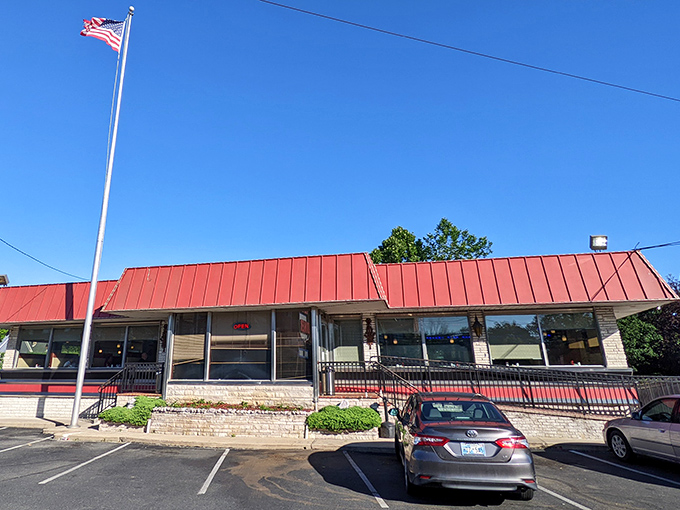 The classic red roof of Route 1 Diner stands like a beacon for hungry travelers, complete with American flag proudly waving &ndash; a true Jersey roadside landmark.