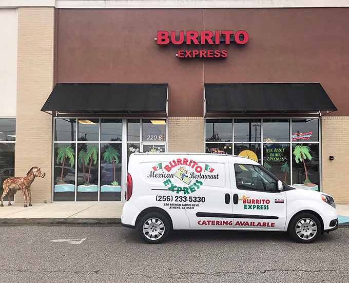 The unassuming storefront of Burrito Express, complete with wooden donkey sentinel, proves that culinary treasures often hide in plain sight.