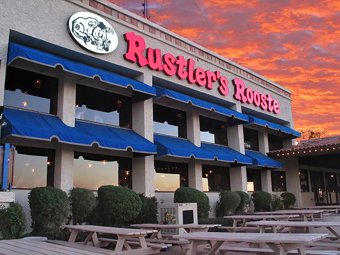 That sunset backdrop makes this Western steakhouse look like a movie set where cowboys actually eat well. 