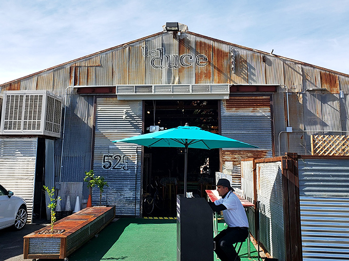 The Duce's exterior is industrial chic personified&mdash;corrugated metal, vintage signage, and that gleaming Airstream trailer promising culinary adventures within.