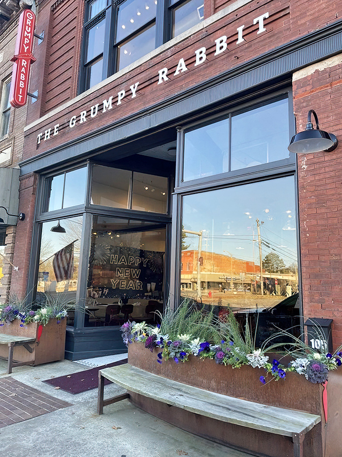 The historic brick facade of The Grumpy Rabbit stands proudly on Lonoke's main street, promising culinary adventures behind those welcoming windows.
