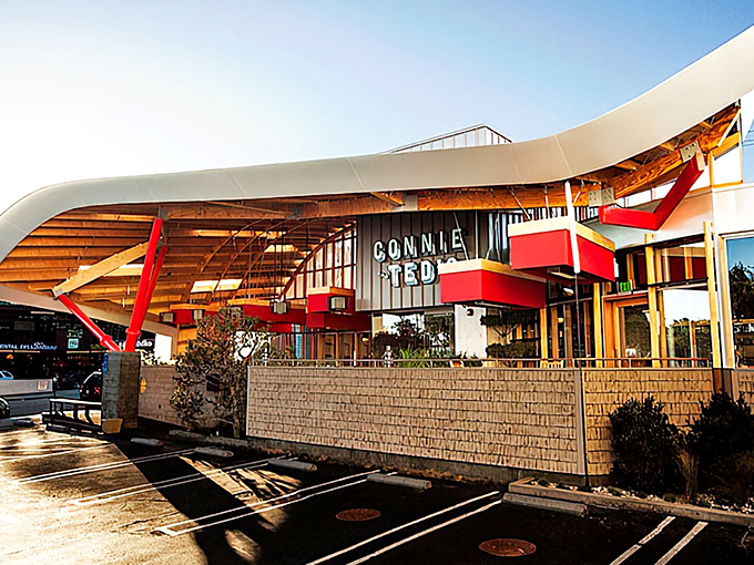 The wave-like roof and bold red beams of Connie and Ted's exterior aren't just architectural showboating—they're a California love letter to New England seafood traditions.