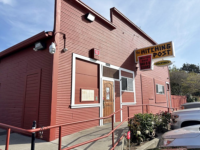 The iconic red exterior of Hitching Post is like a beacon to steak lovers, promising smoky, oak-grilled perfection inside this Casmalia landmark.
