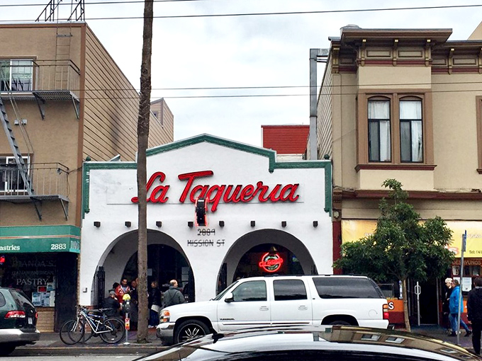 The iconic white facade with its distinctive red script beckons hungry pilgrims like a taco temple. Those arches aren't just decorative&mdash;they're gateways to burrito bliss.