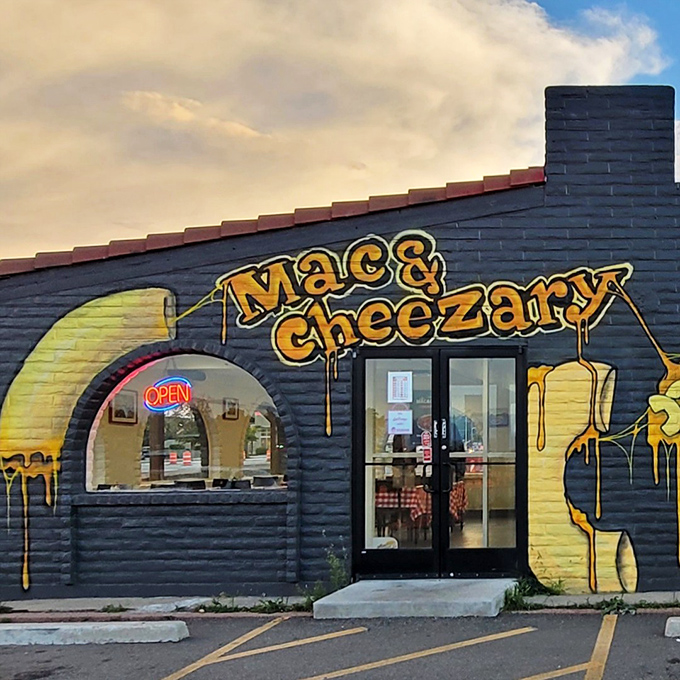 The blue building with dripping yellow cheese art isn't subtle about its mission. Like a cheese-themed Bat Signal calling comfort food lovers home.