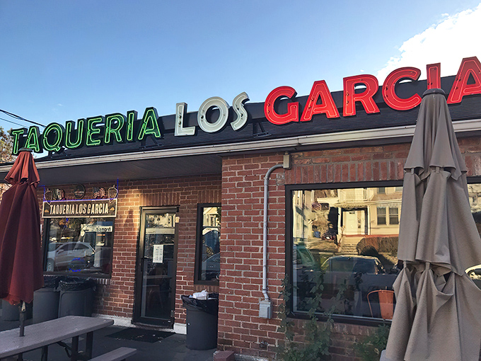 The colorful exterior of Los Garcia beckons hungry patrons with its vibrant sugar skull artwork and Mexican flag colors. Worth the wait in any weather!