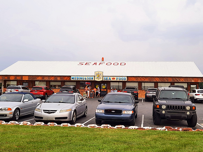 The blue and yellow sign beckons like a lighthouse for hungry sailors. Meding's weathered wooden exterior promises authentic seafood without pretension.