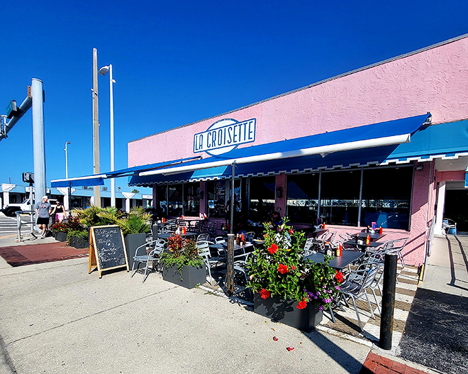La Croisette's cheerful pink exterior with blue awnings stands out like a breakfast beacon on St. Pete Beach, promising French-inspired delights inside.
