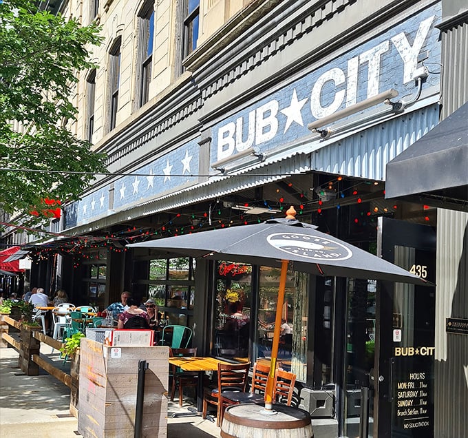 The patriotic bunting and bold signage of Bub City's exterior promises three essential food groups: BBQ, country music, and beer. A trifecta of American pleasure.