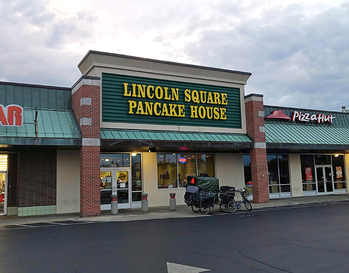The green and yellow beacon of breakfast hope stands proudly in an Indianapolis strip mall, promising pancake perfection to all who enter.