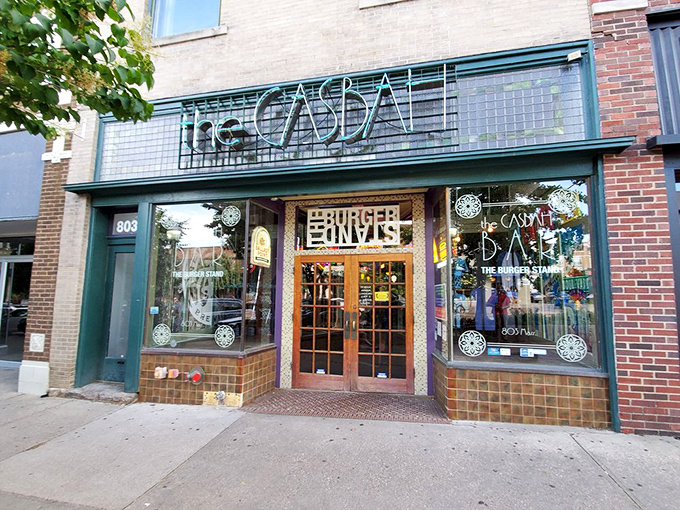 The tiled facade of The Casbah beckons like a culinary oasis on Massachusetts Street, promising burger nirvana behind those wooden doors.