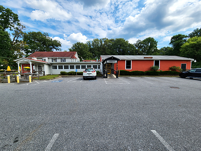 The unassuming exterior of The Hideaway belies the culinary treasures within. Those colorful umbrellas are like beacons calling hungry travelers home.