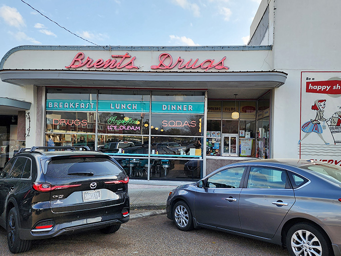 The neon promise of "Breakfast, Lunch, Dinner" glows beneath that iconic retro signage, like a time machine disguised as a storefront in Jackson's Fondren neighborhood.
