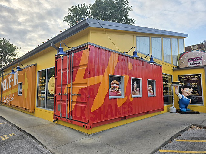 Welcome to burger paradise! Hi-Pointe Drive-In's whimsical exterior, complete with a giant burger sculpture, promises the kind of meal that makes grown adults giggle with anticipation.