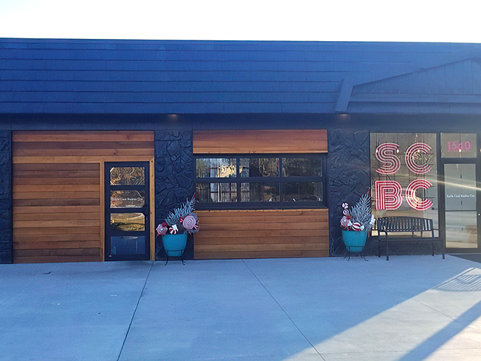 That neon pink SCBC sign glows like a breakfast beacon, promising morning salvation to hungry Omahans seeking refuge from ordinary eggs.