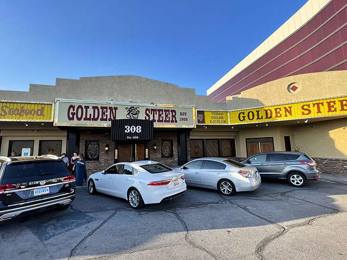 The unassuming exterior of Golden Steer stands like a time capsule amid Vegas glitz, its vintage yellow sign promising authentic experiences inside.