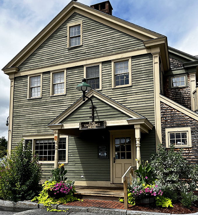 The quintessential New England welcome! This charming green colonial exterior promises comfort food treasures within, like finding Grandma's house if Grandma were a culinary genius.