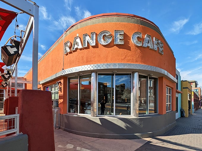 The iconic red exterior of Range Cafe beckons hungry travelers with its bold "BREAKFAST LUNCH DINNER" promise&mdash;a siren song for comfort food enthusiasts.